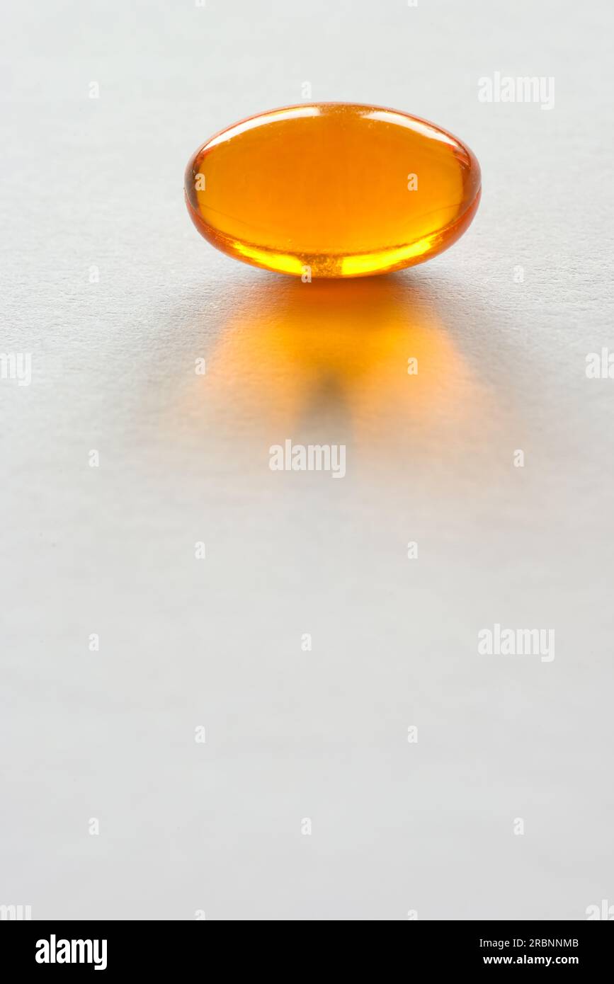 Detail of orange pills in packaging and isolated for healthcare Stock ...