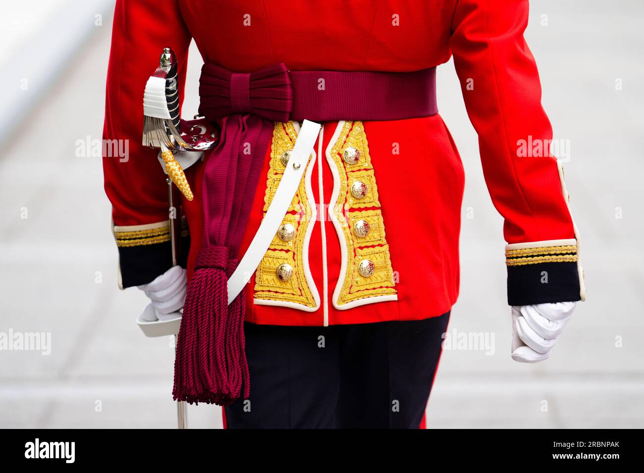 Ens. Jean Murad wears a crimson sash as Ceremonial Guards from the Canadian Grenadier Guards ...