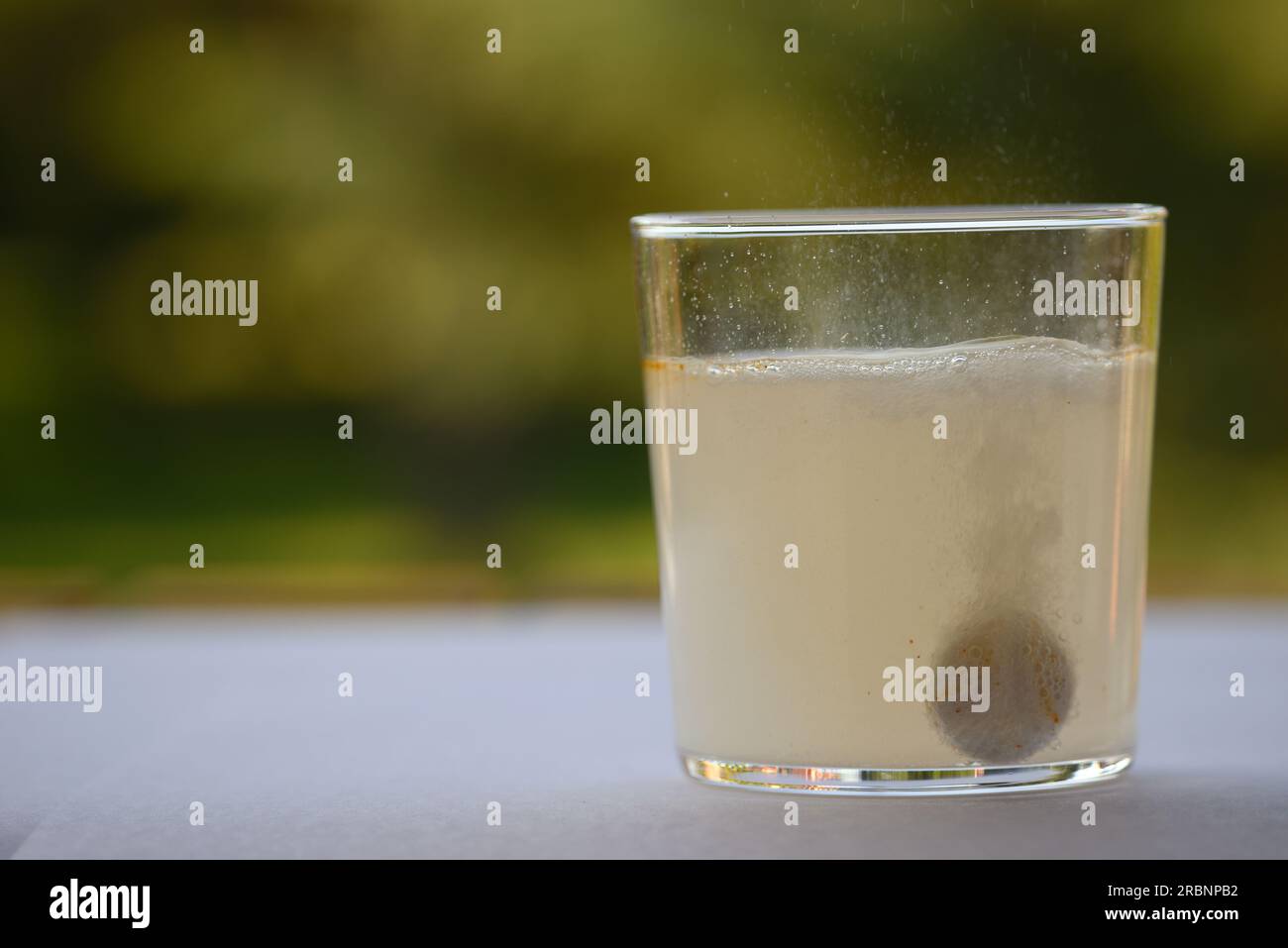 Effervescent tablet for flu and cold like symptoms in glass of water ...