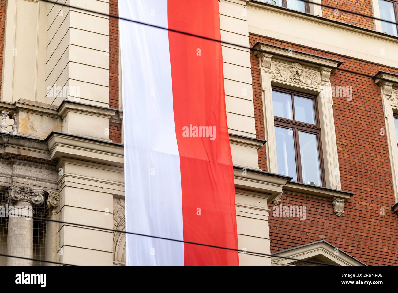 Large Polish flag hanging from the side of a building, Poland, Polish ...