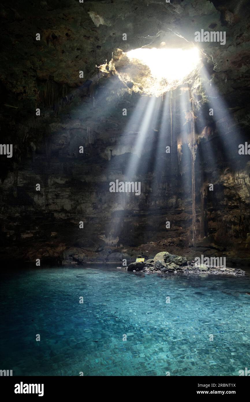 Sunbeams enter Cenote Xkeken near Valladolid through a hole in the rock ...