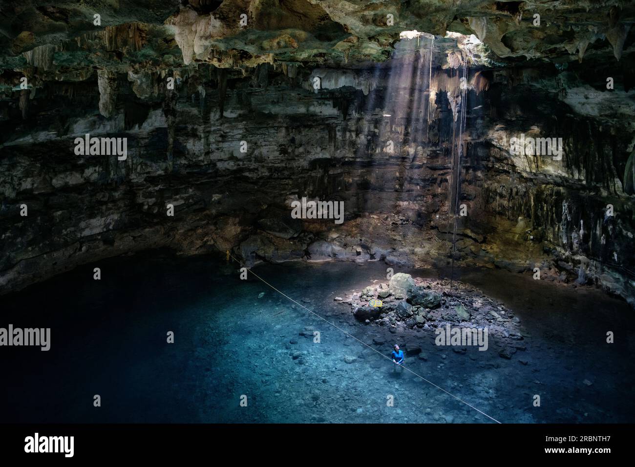 Sunbeams enter Cenote Xkeken near Valladolid through a hole in the rock ...