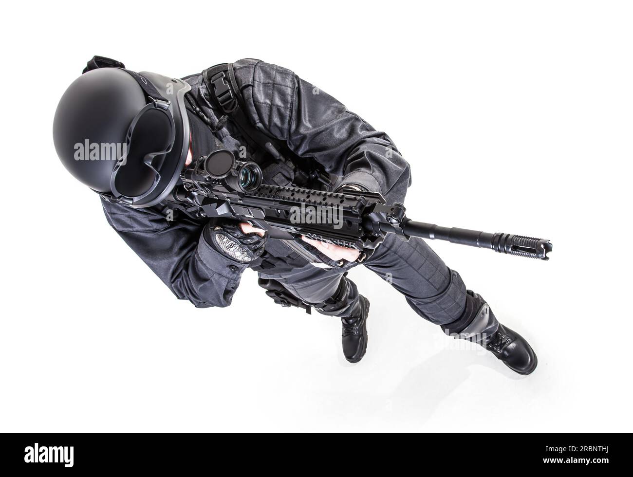 Spec ops police officer SWAT in black uniform aiming service rifle ...