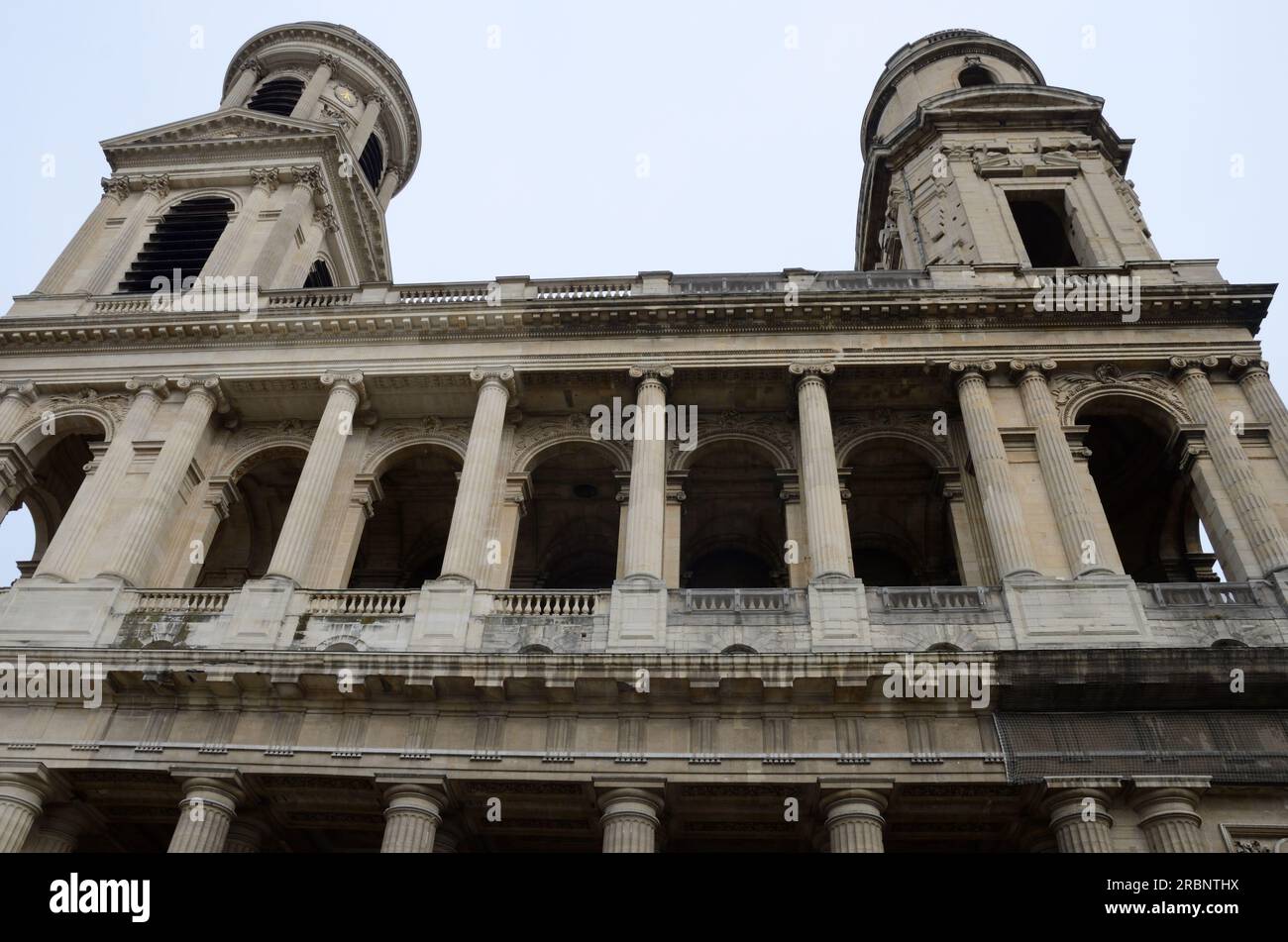 Upper side view of main facade Saint Sulpice church in Paris, France ...