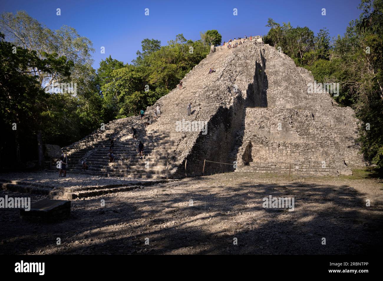 Visitors climbing the ruins of the Nohoch Mul pyramid in the Mayan ...
