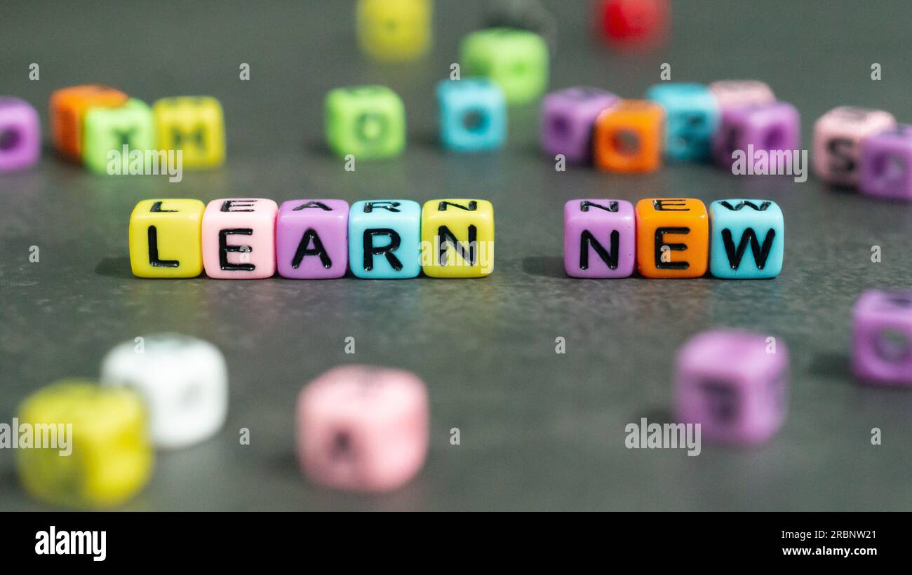 Learn new slogan in colorful block letter beads. Education and lifetime ...