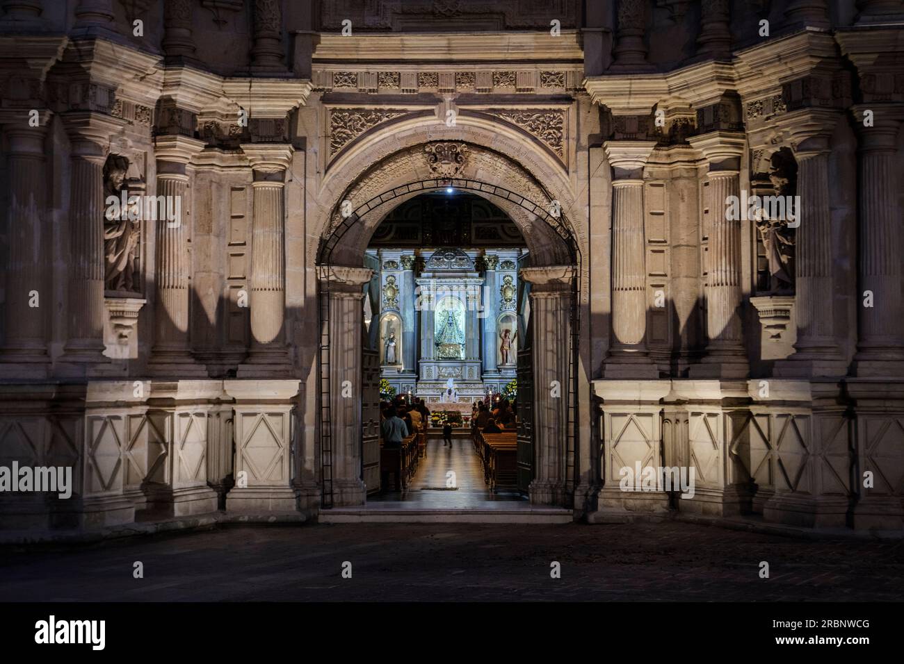 Magnificent, illuminated facade of the basilica "Basílica de Nuestra ...