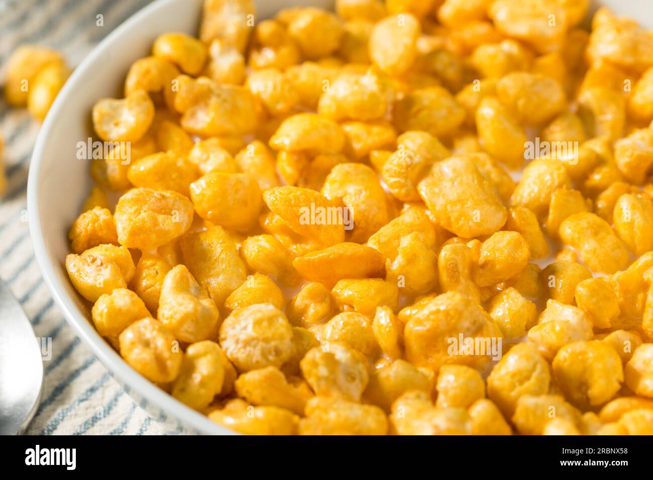 Sweet Sugar Puffed Corn Cereal for Breakfast in a Bowl Stock Photo - Alamy