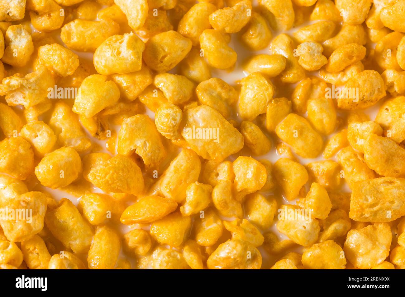 Sweet Sugar Puffed Corn Cereal for Breakfast in a Bowl Stock Photo - Alamy