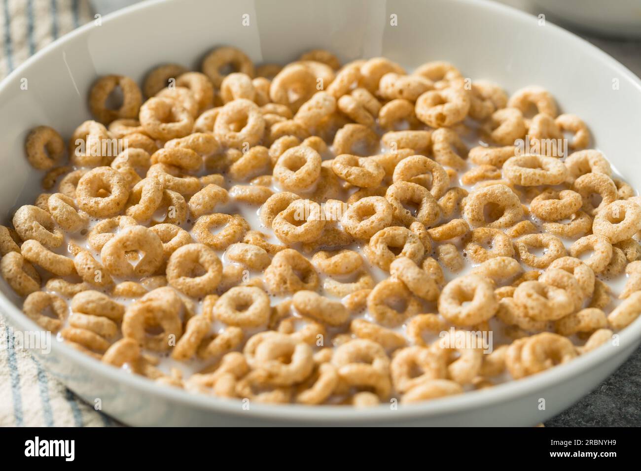 Healthy Oat Breakfast Cereal Rings with Whole Milk Stock Photo - Alamy