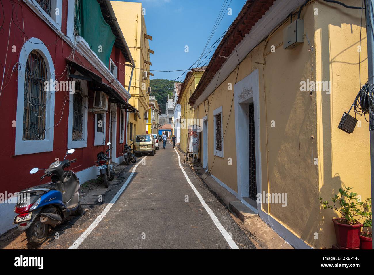 Goa, India -- April 10, 2023.A wide angle photo of a side street in ...