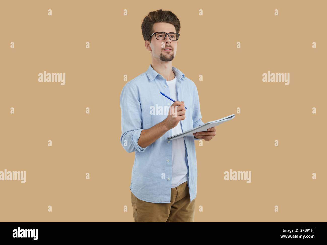 Attractive, self-confident young man in glasses, dressed in casual ...