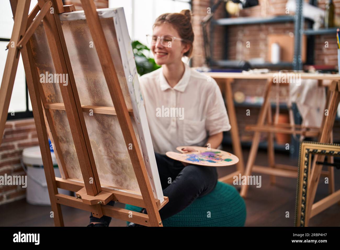 Young blonde woman artist smiling confident drawing at art studio Stock ...
