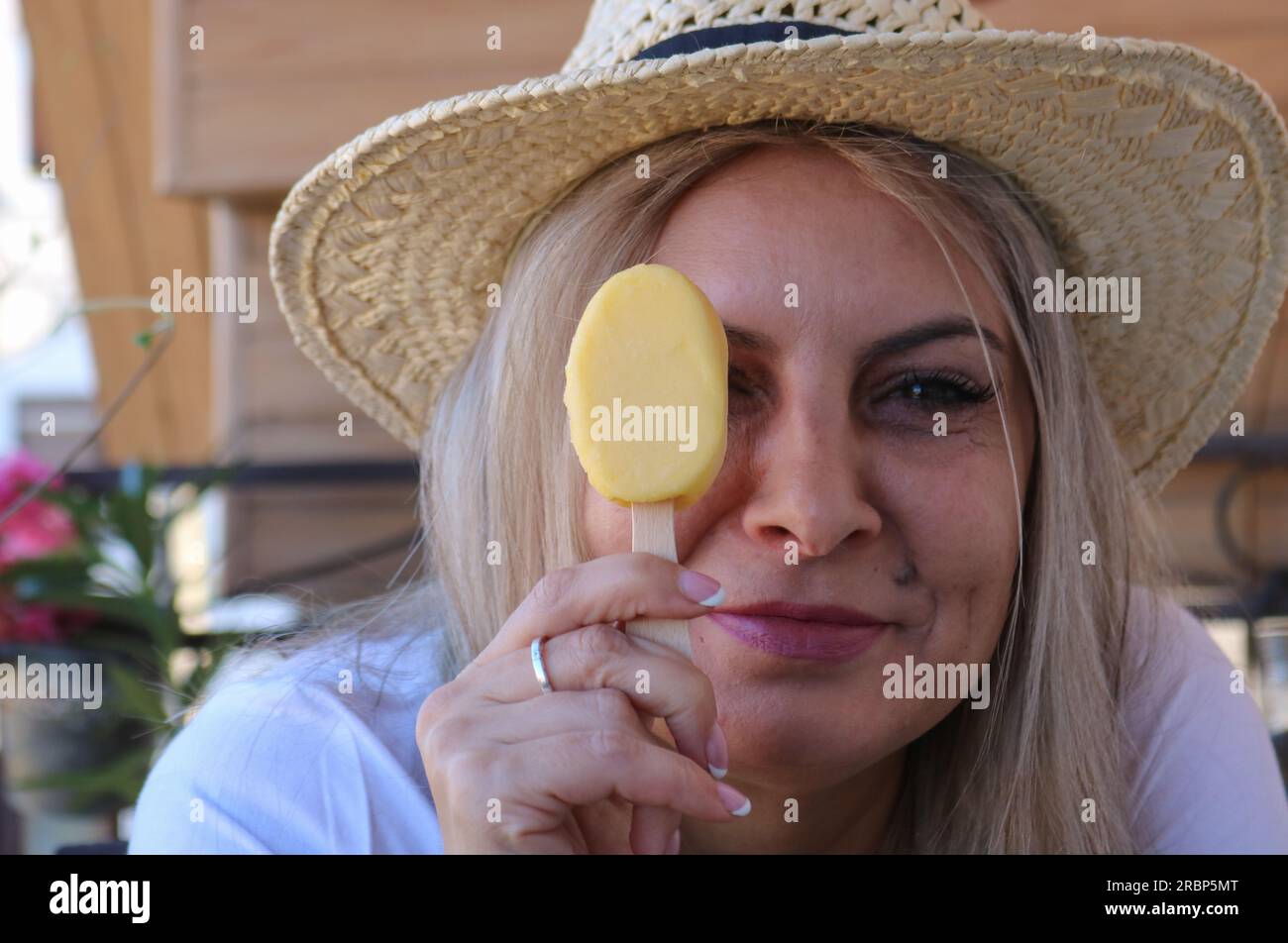 Woman eating ice cream Stock Photo - Alamy