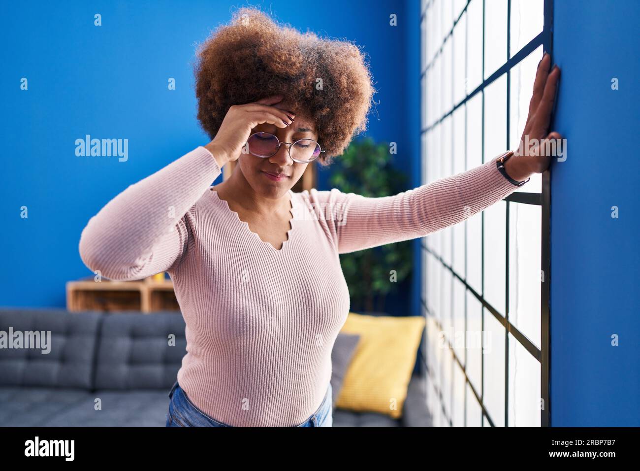 African american woman suffering for dizziness at home Stock Photo - Alamy