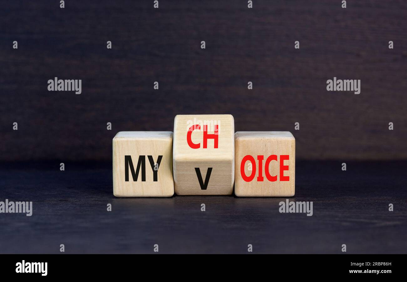 My voice and choice symbol. Businessman turns wooden cubes and changes ...