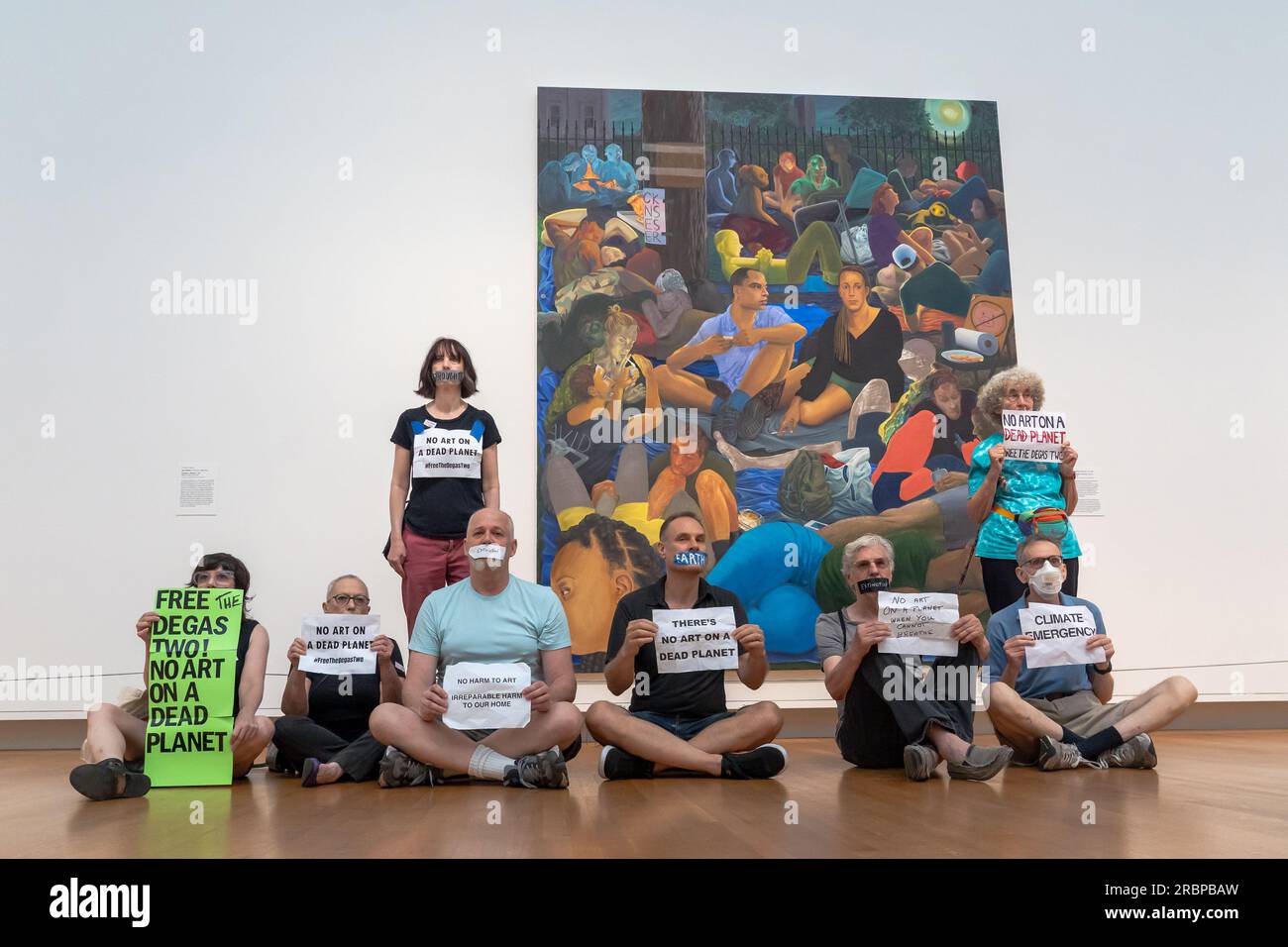 Members of Extinction Rebellion NYC and Rise and Resist with strips of ...