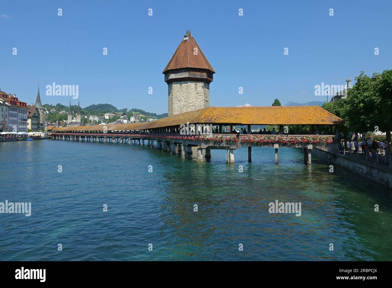 The historic Kapellbrücke (or Chapel Bridge) wood bridge and stone ...