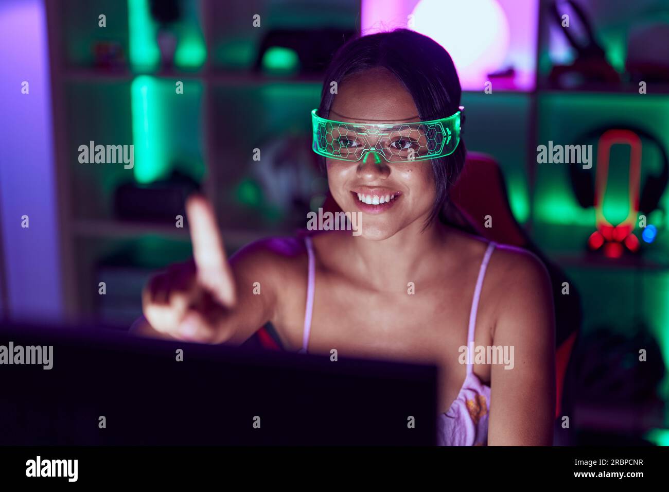 Young hispanic woman streamer using computer and virtual reality ...