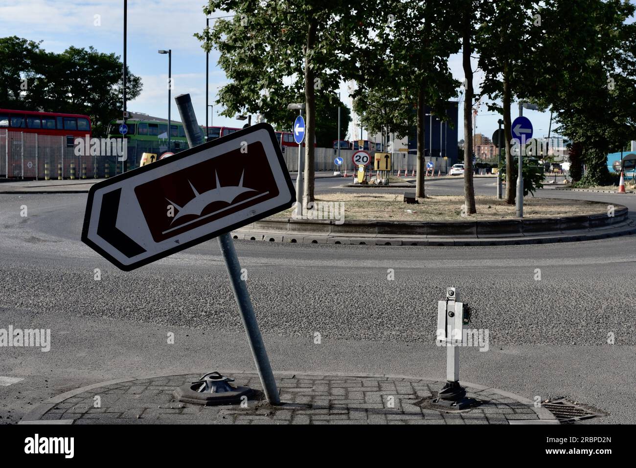 The O2 sign post falling over Stock Photo - Alamy