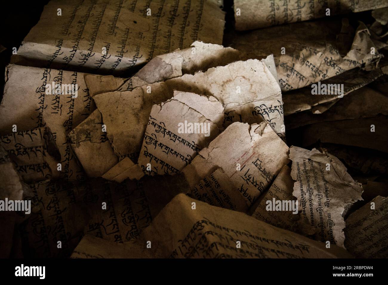 Prayer book pages at Yara Cave Monastery on Lo Manthang Trek, Mustang ...