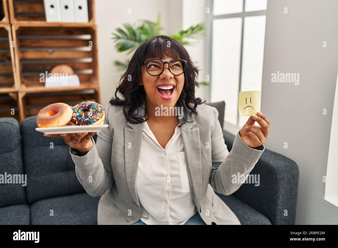 Hispanic therapist woman working on eating disorder angry and mad ...