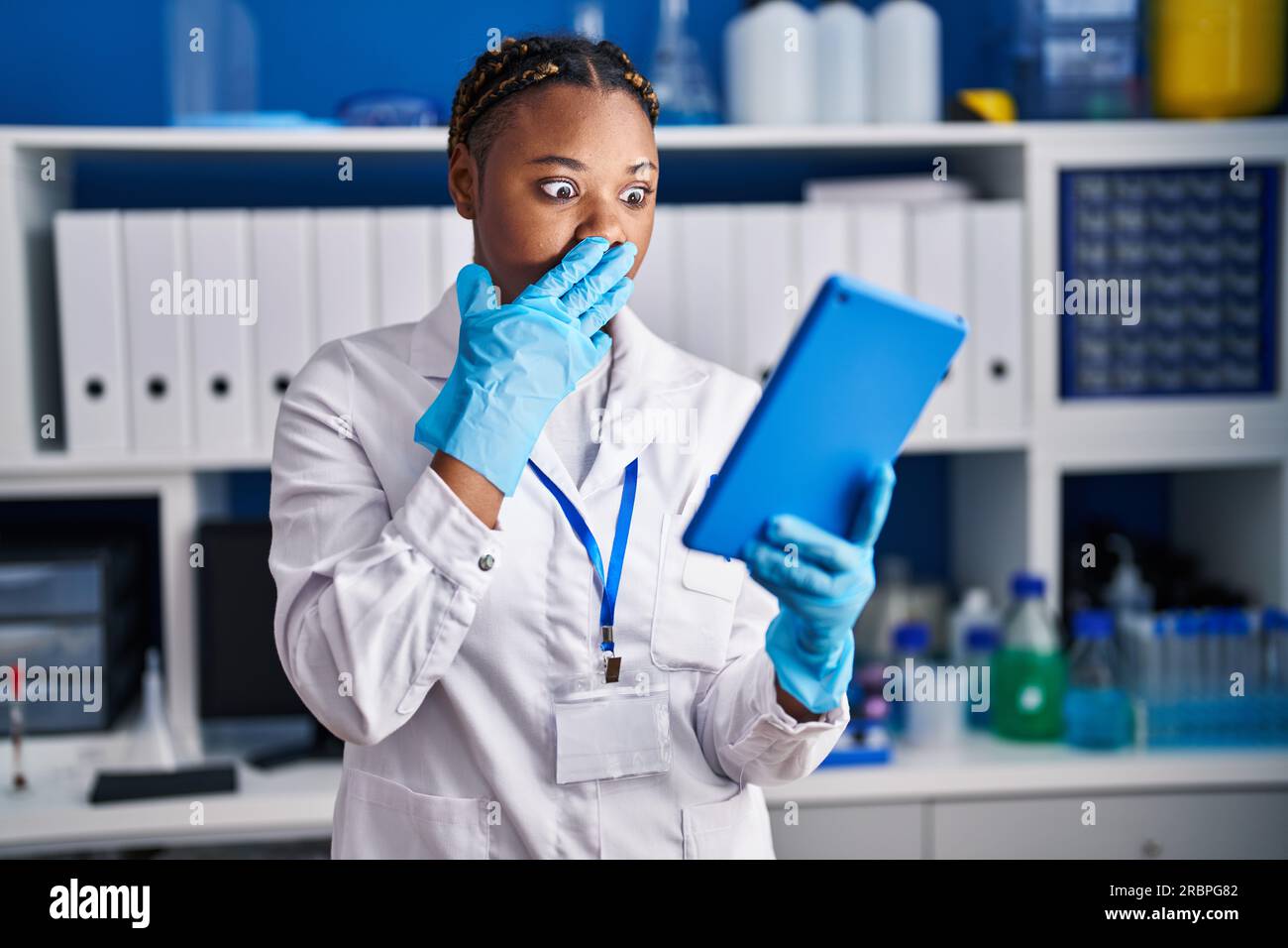 African american woman with braids working at scientist laboratory ...