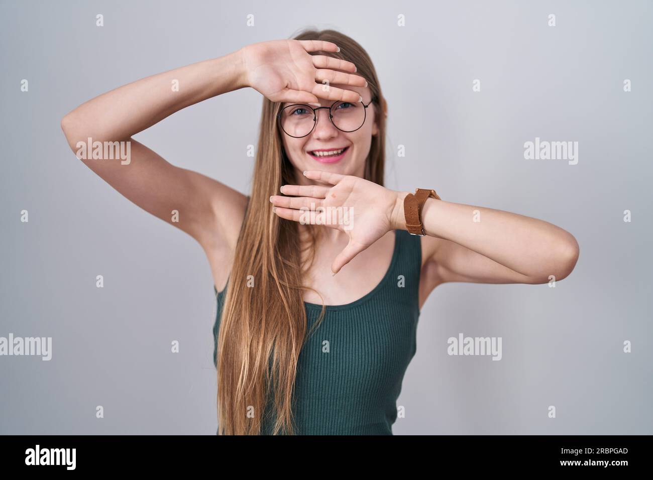 Young caucasian woman standing over white background smiling cheerful ...