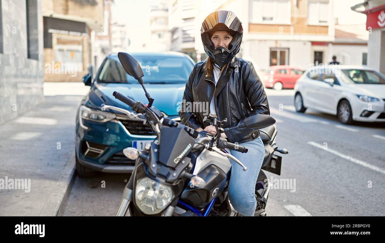 Young woman driving motorcycle hi-res stock photography and images - Alamy