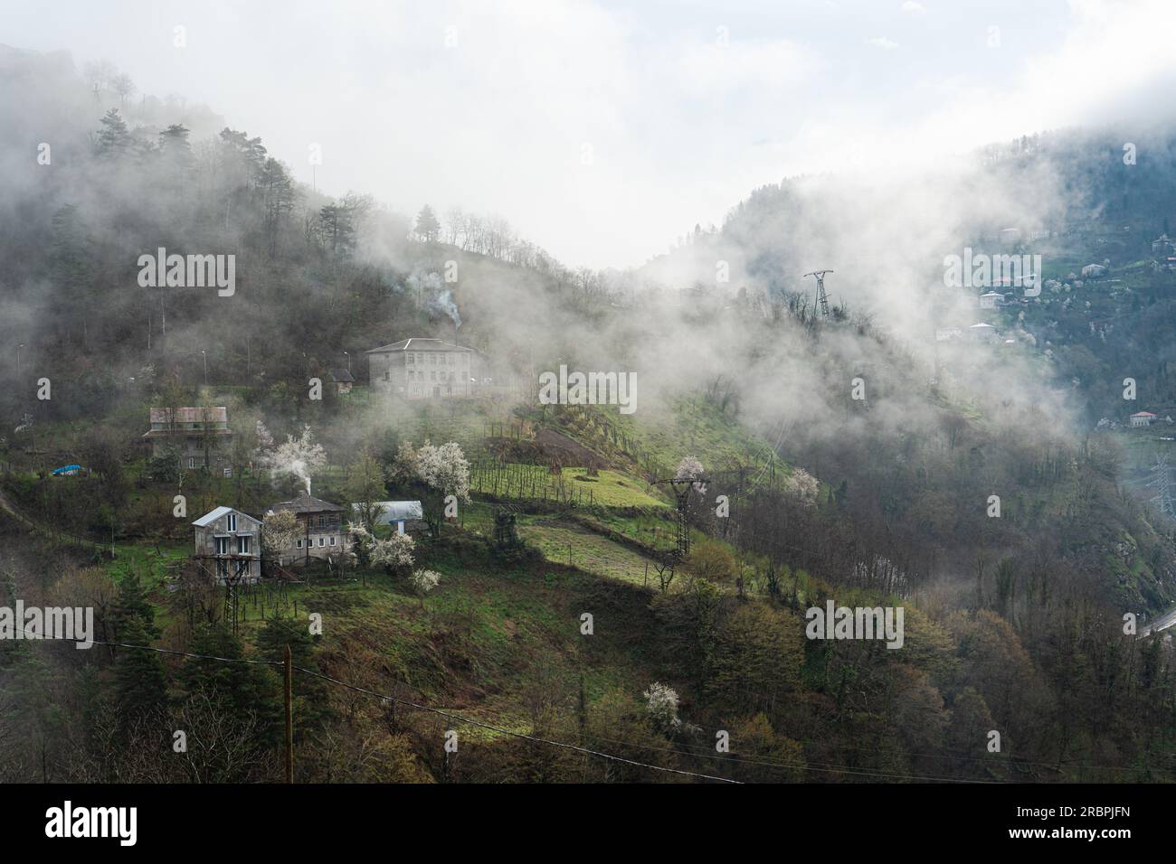 Little village in the Adjarian mountain region of Georgia in misty day ...