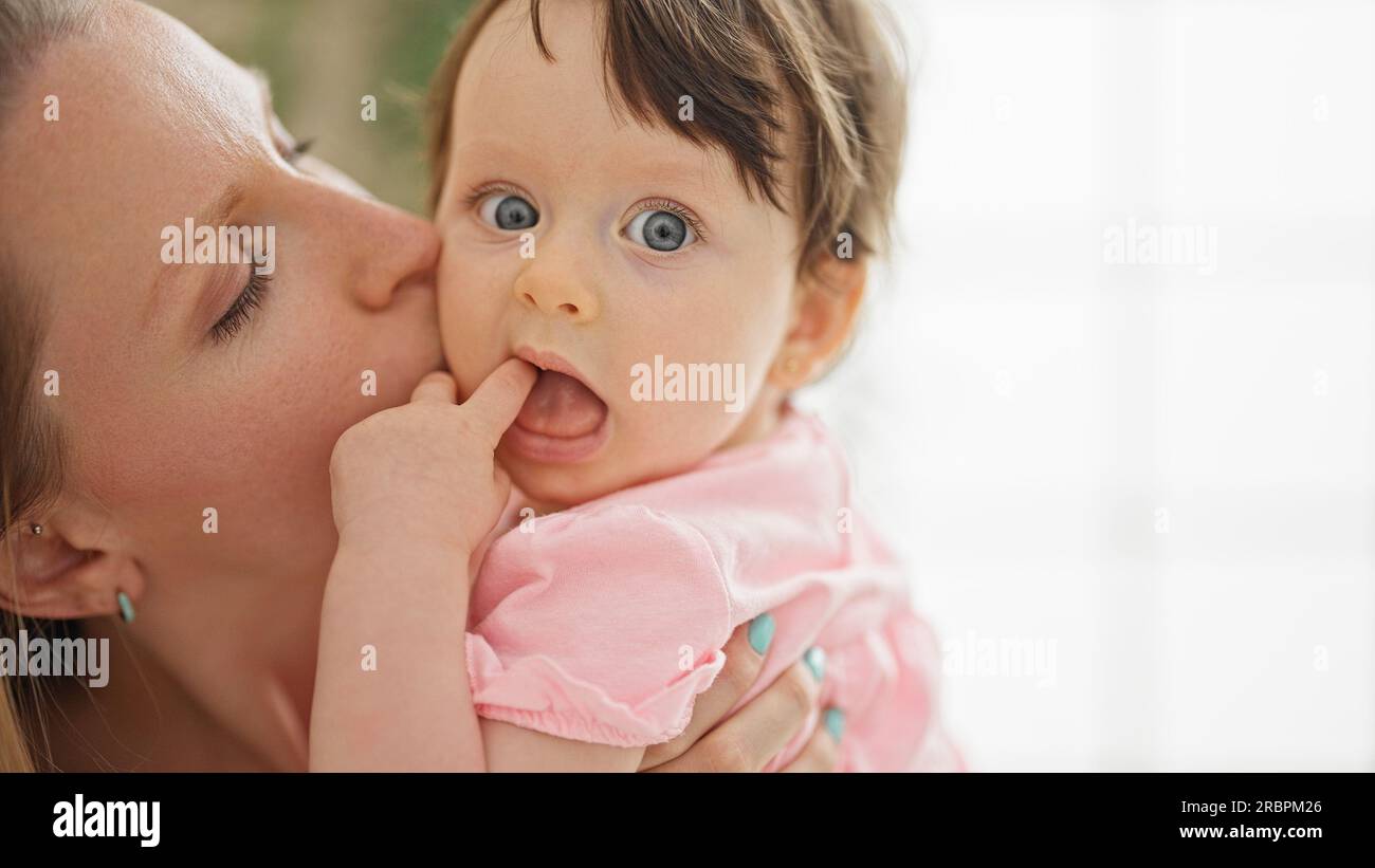 Mother and daughter hugging each other kissing at bedroom Stock Photo - Alamy