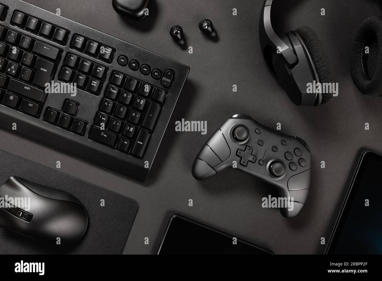 Various modern black wireless devices on desk Stock Photo - Alamy
