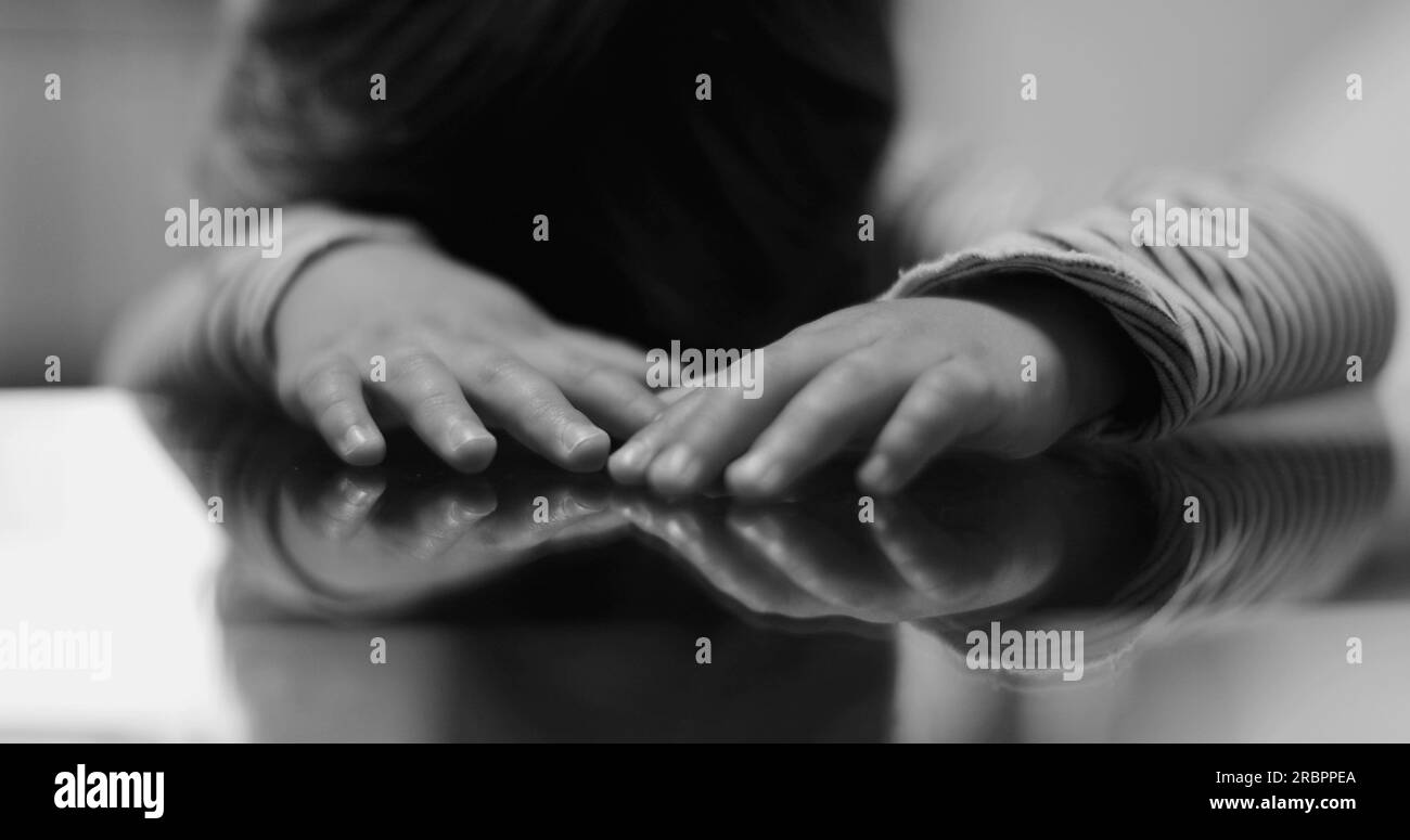 Depressed child covering face trauma concept in monochrome Stock Photo ...