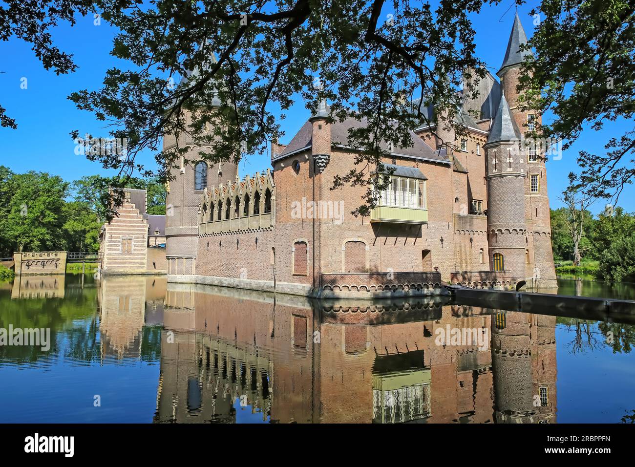 Beautiful green dutch garden park with water moat and reflections of ...
