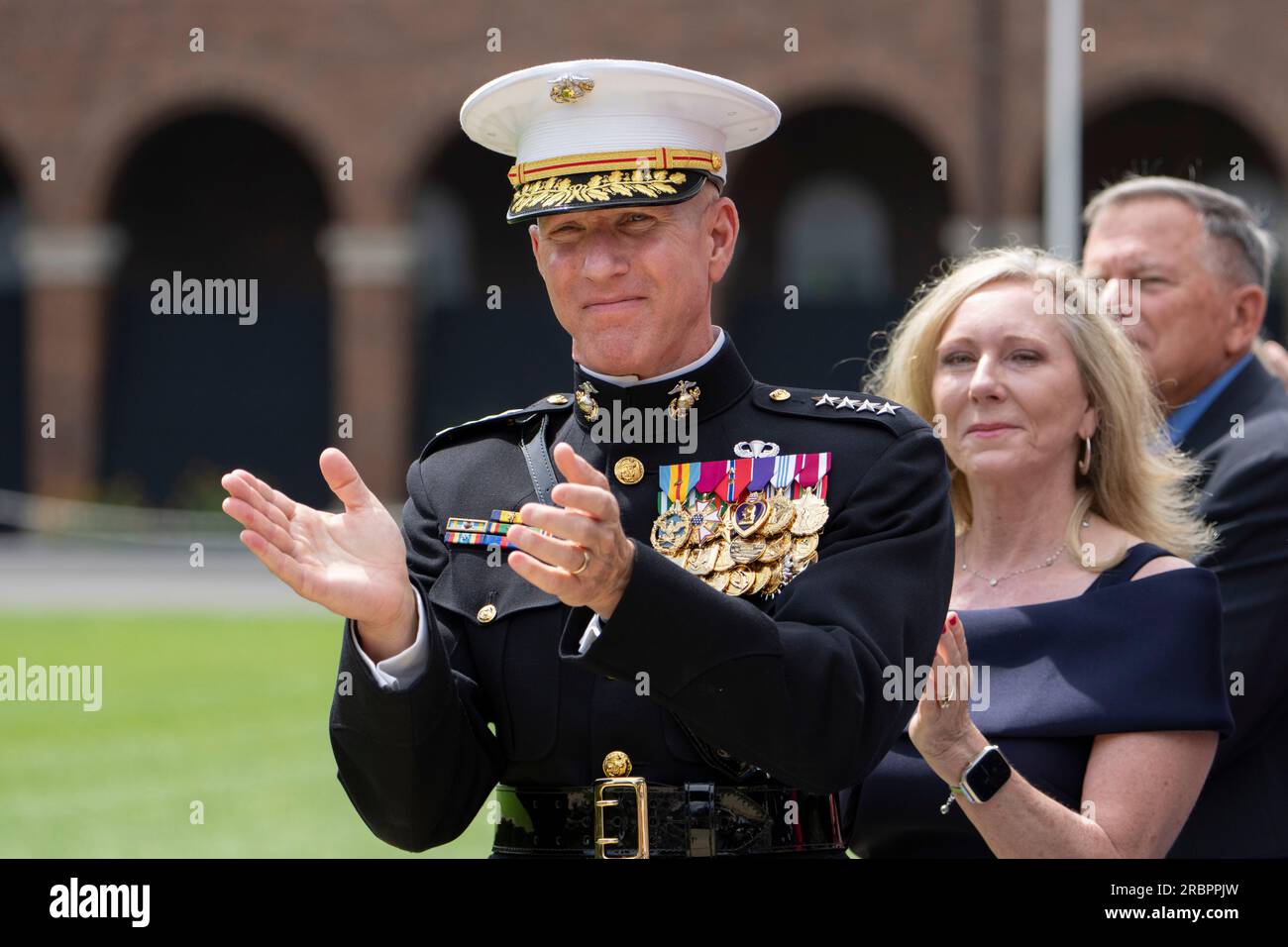 Acting Commandant of the U.S. Marine Corps Gen. Eric Smith applauds during a relinquishment of ...