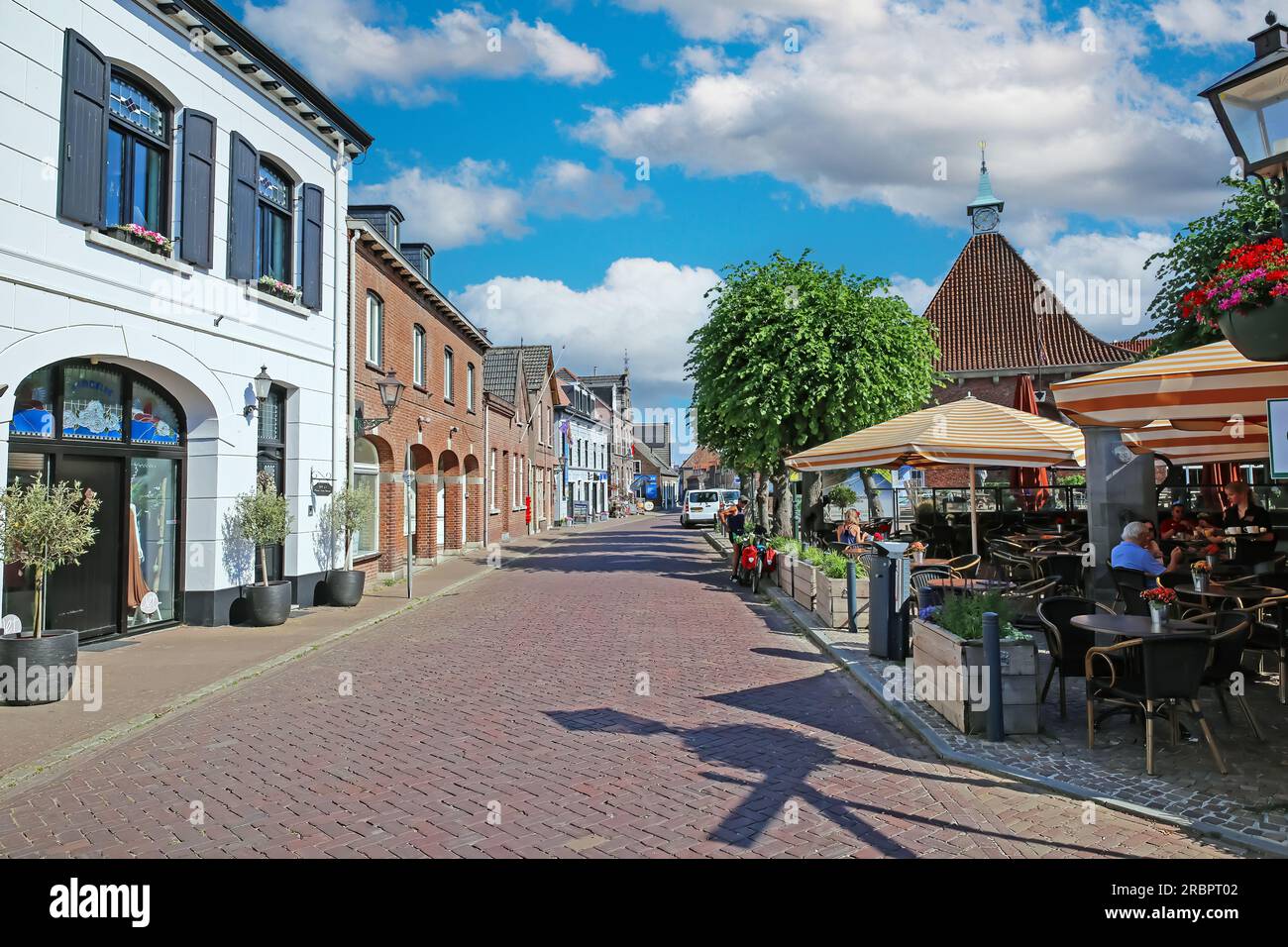Arcen, Netherlands - June 16. 2023: typical dutch town street with ...