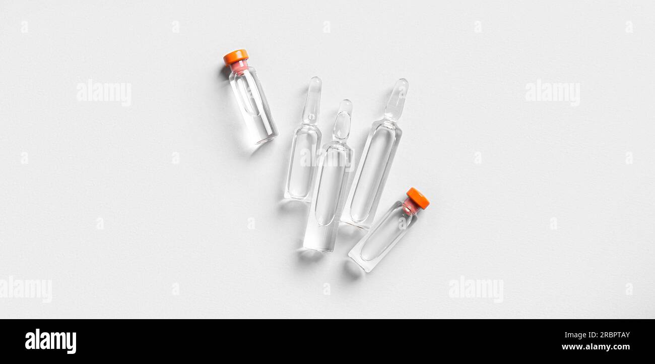 Medical ampules on light background Stock Photo - Alamy
