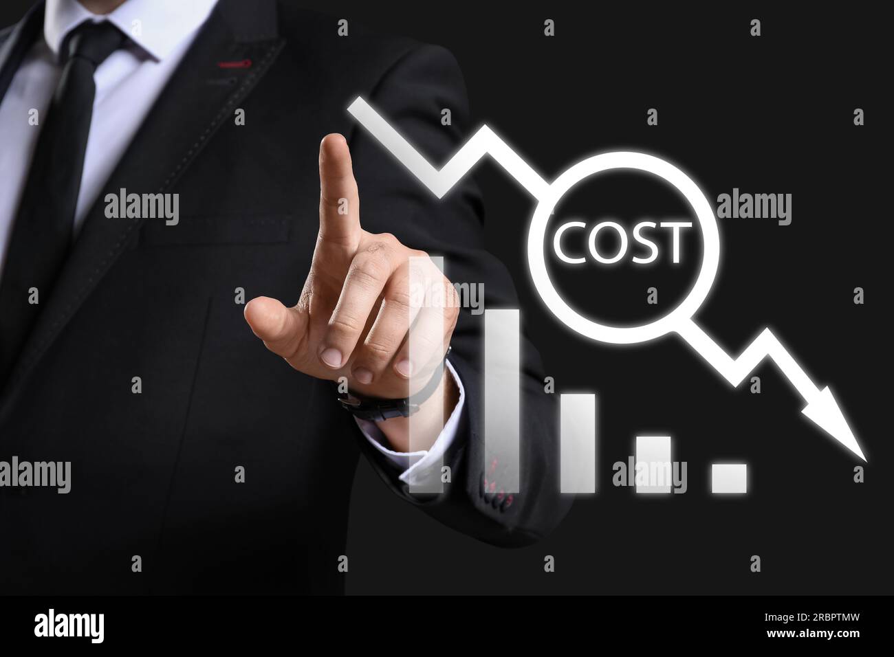 Businessman using virtual screen on dark background. Cost reduction ...