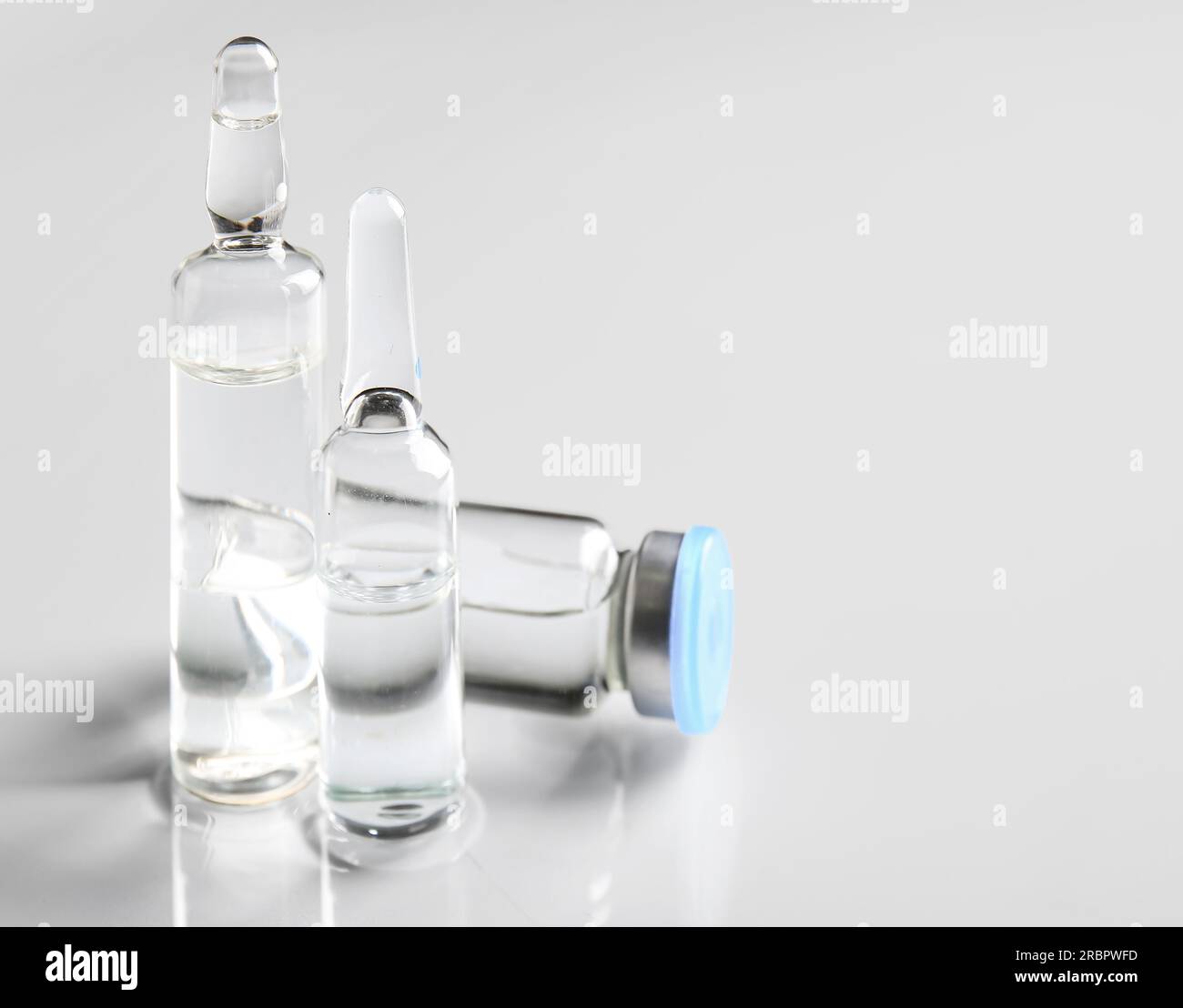 Medical ampules on light background Stock Photo - Alamy