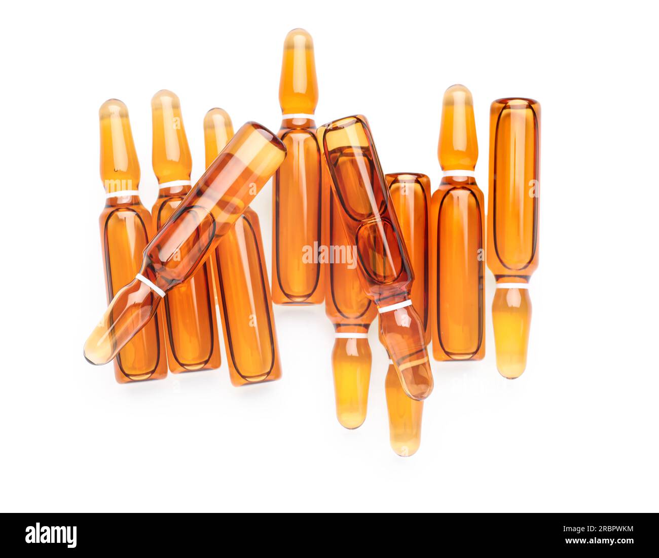Many scattered ampules on white background Stock Photo - Alamy