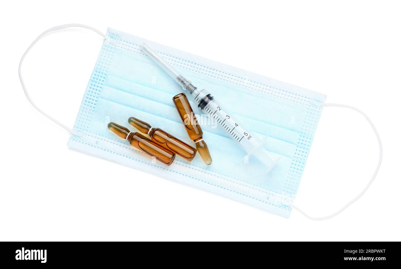 Ampules, syringe with needle and mask on white background Stock Photo ...