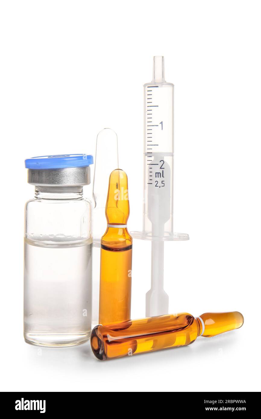 Ampules, bottle with medicines and syringe on white background Stock ...