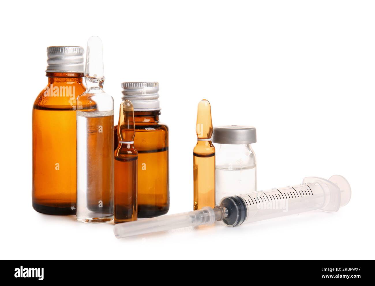 Ampules with bottles of medicines and syringe on white background Stock ...