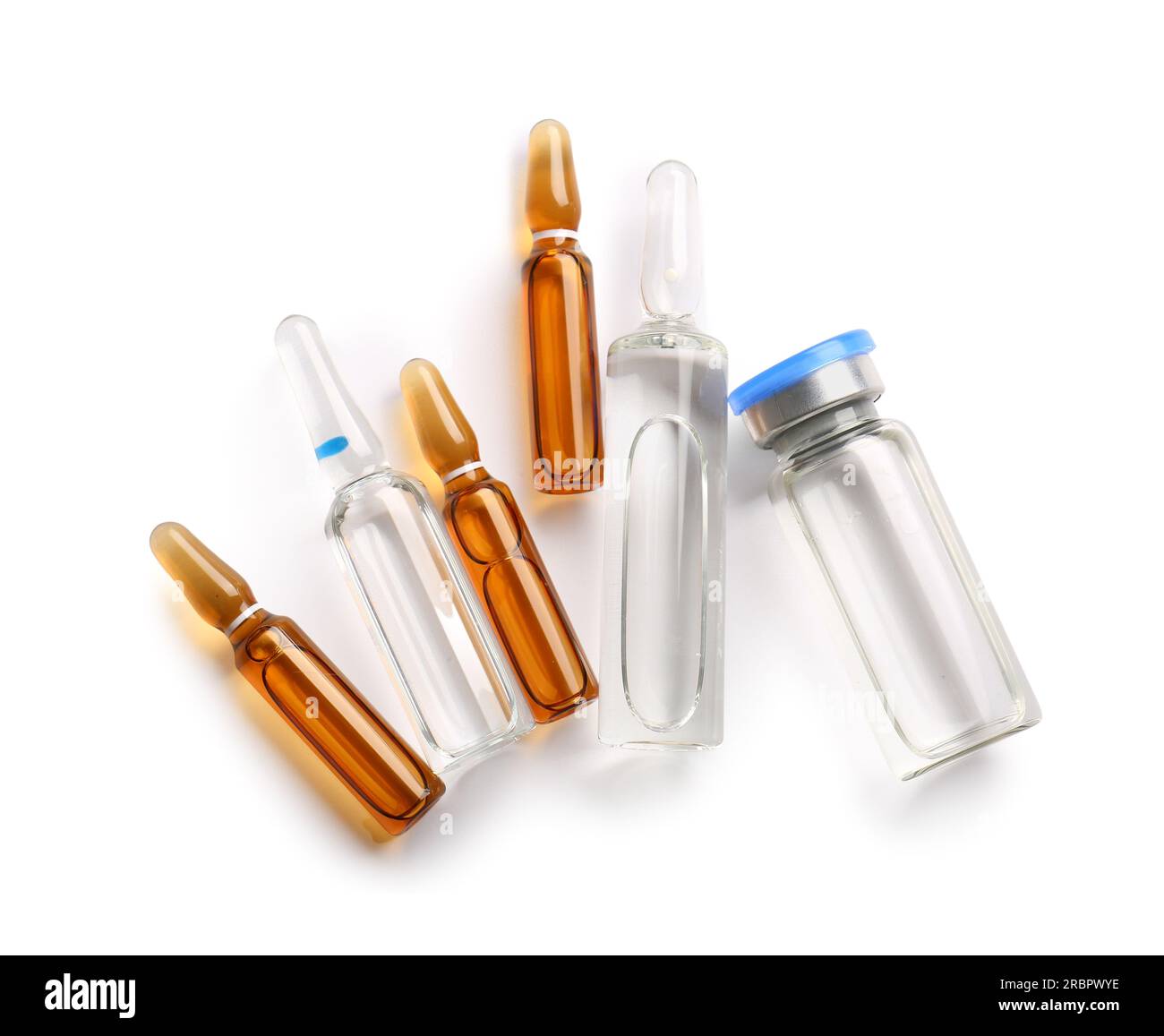 Glass medical ampules and bottle with medicines on white background ...