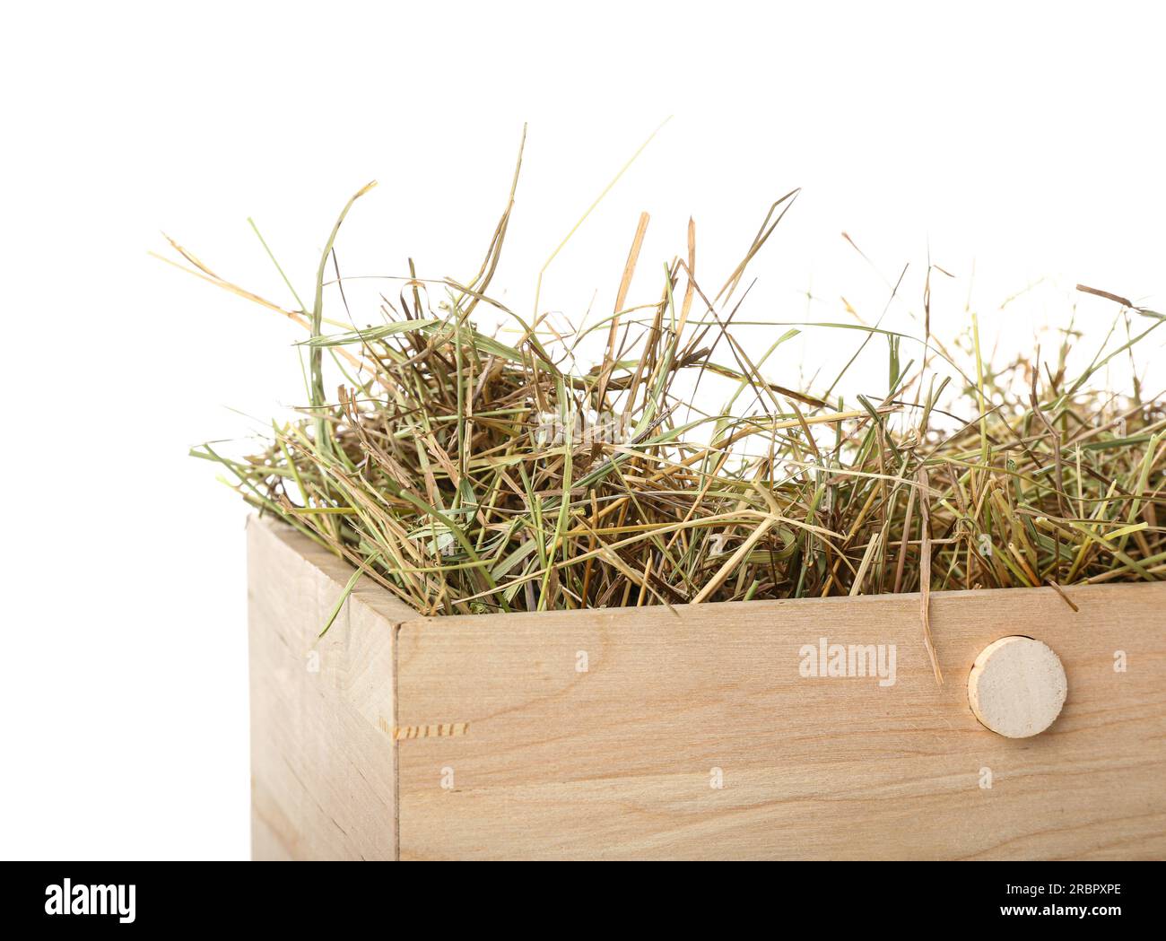 Straw in crate on white background Stock Photo - Alamy