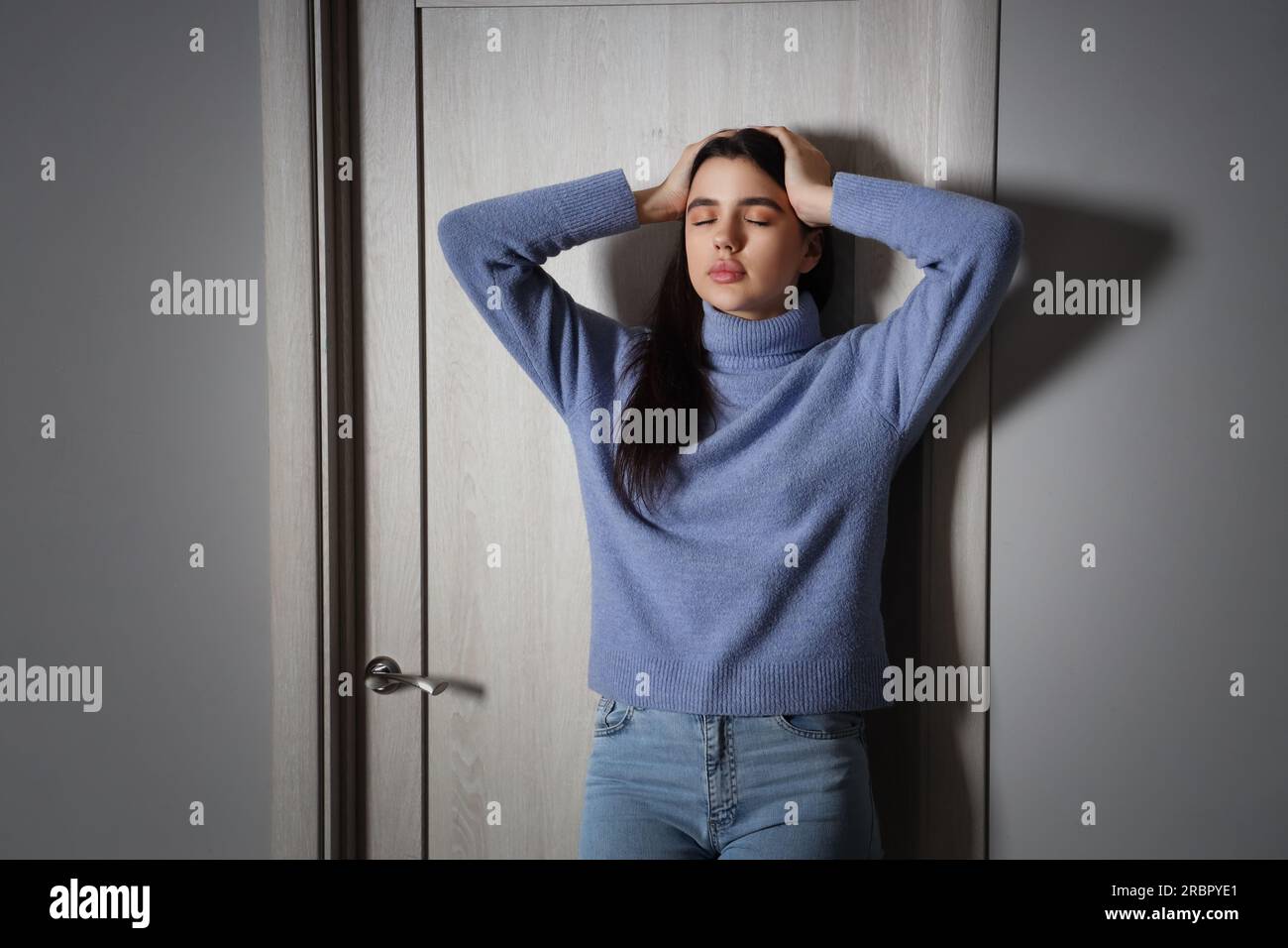 Young woman having panic attack at home Stock Photo - Alamy