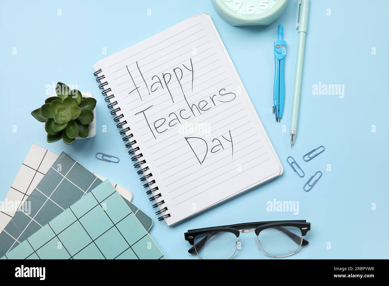 Notebooks with text HAPPY TEACHERS DAY, eyeglasses and stationery on ...