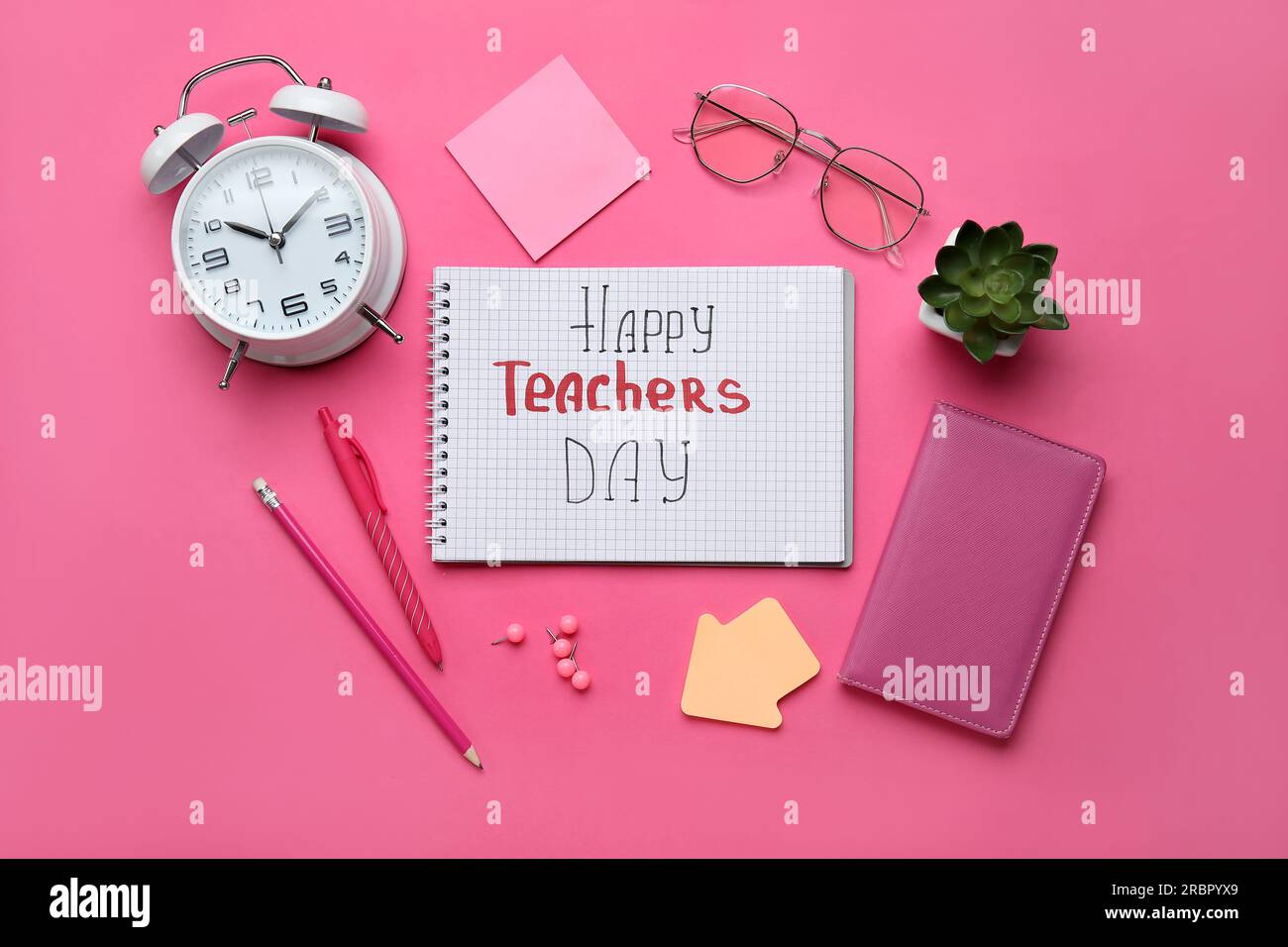 Notebook with text HAPPY TEACHERS DAY, eyeglasses and alarm clock on ...