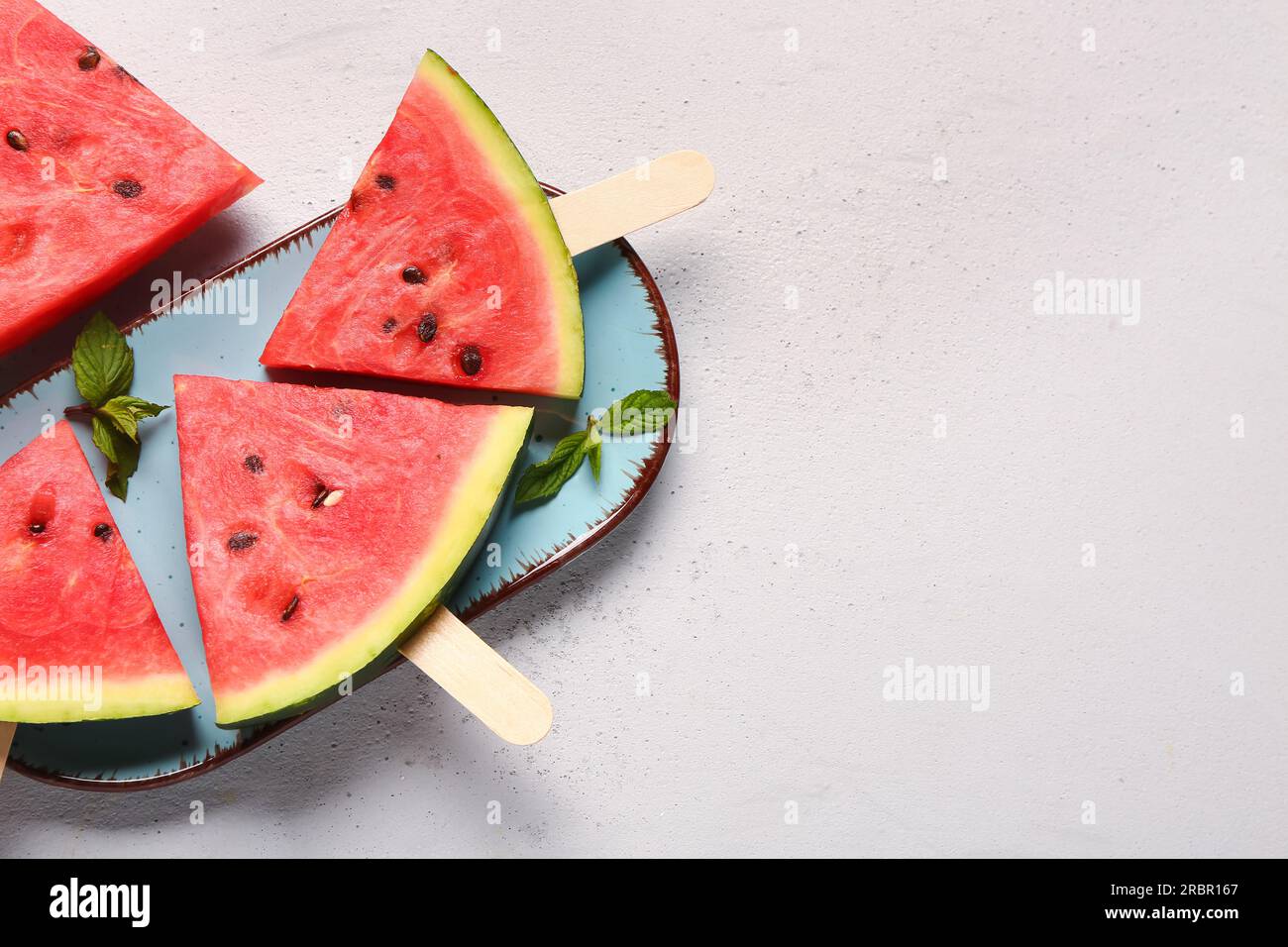 PLate with sweet watermelon sticks and mint on white background Stock ...