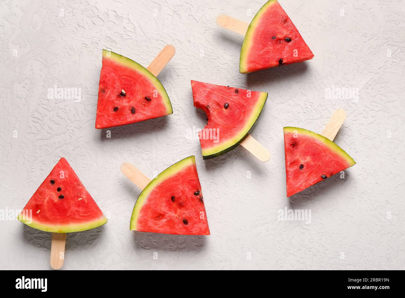 Sweet watermelon sticks on white background Stock Photo - Alamy